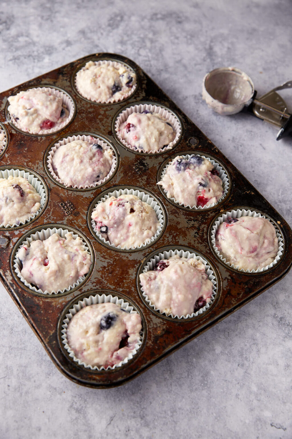 Mixed Berry Muffins with Streusel Topping - Butter & Baggage
