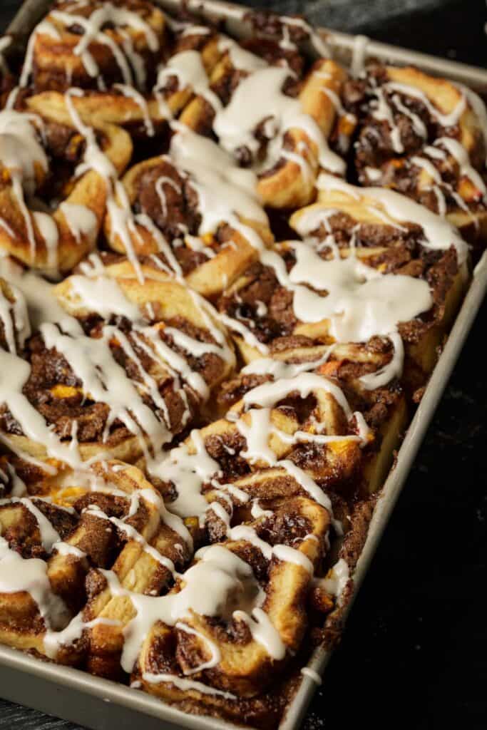 Peach Cinnamon Rolls with Bourbon Glaze - Butter & Baggage