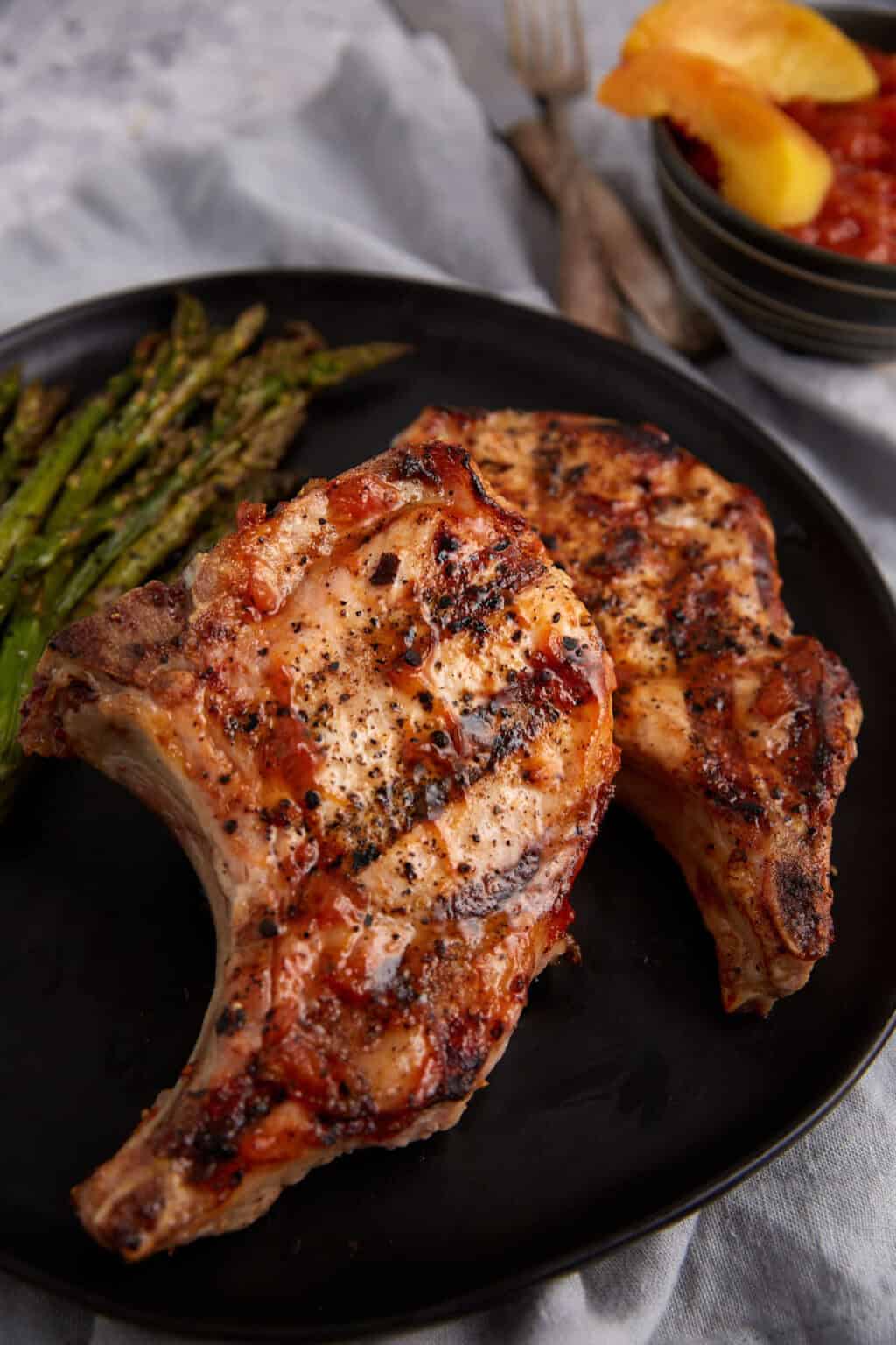 BBQ Pork Chops with Peach Barbecue Sauce - Butter & Baggage