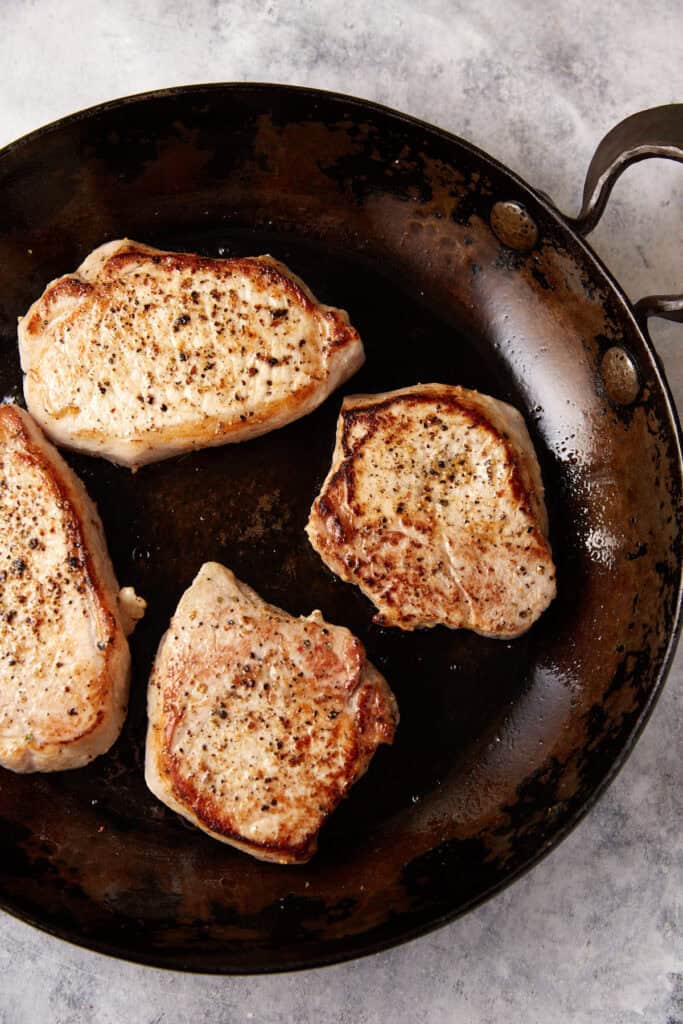 Easy Skillet Pork Chops with Garlic Herb Boursin Sauce - Butter & Baggage