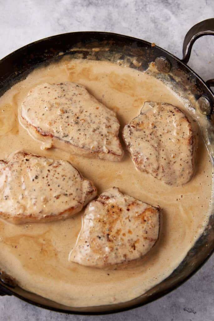 Easy Skillet Pork Chops with Garlic Herb Boursin Sauce - Butter & Baggage