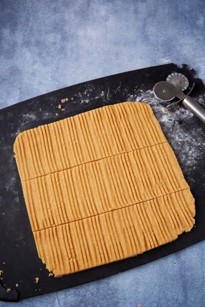 Southern Cheese Straws with Sharp Cheddar Cheese - Butter & Baggage